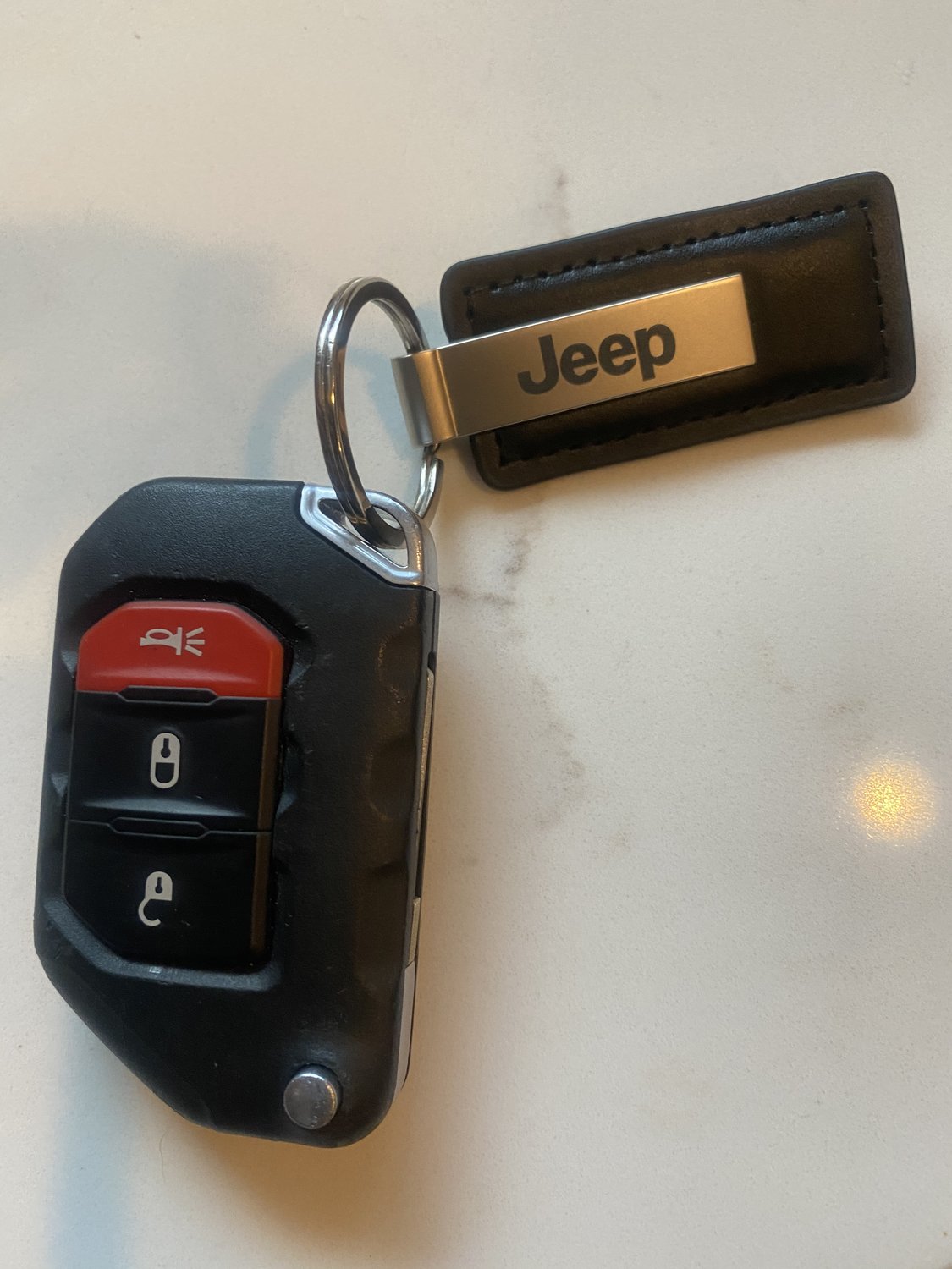 Automotive Gold KC1540JEE Black Leather Jeep Logo Keychain | Quadratec