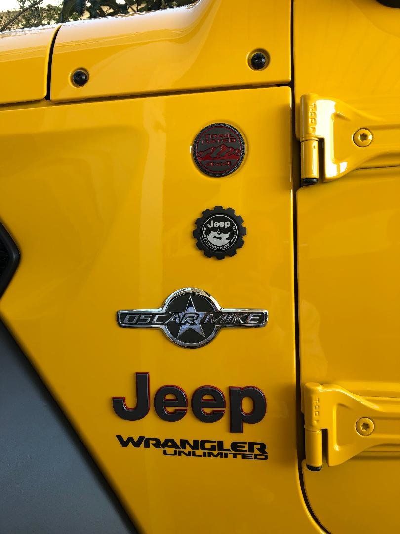 Mopar 68093911AB "Oscar Mike" Badge for Jeep Vehicles | Quadratec